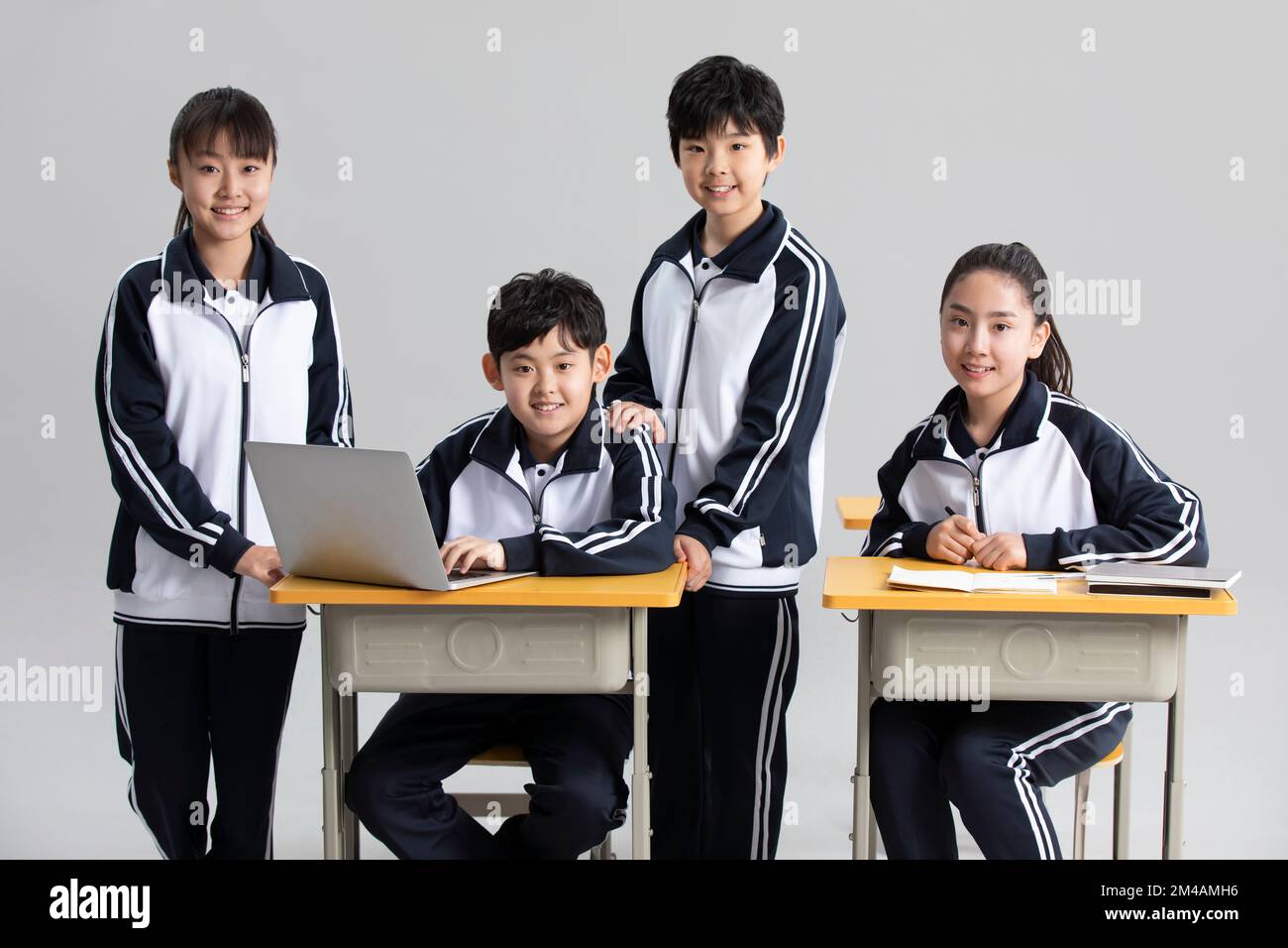 Chinese students learning with laptop in classroom Stock Photo - Alamy