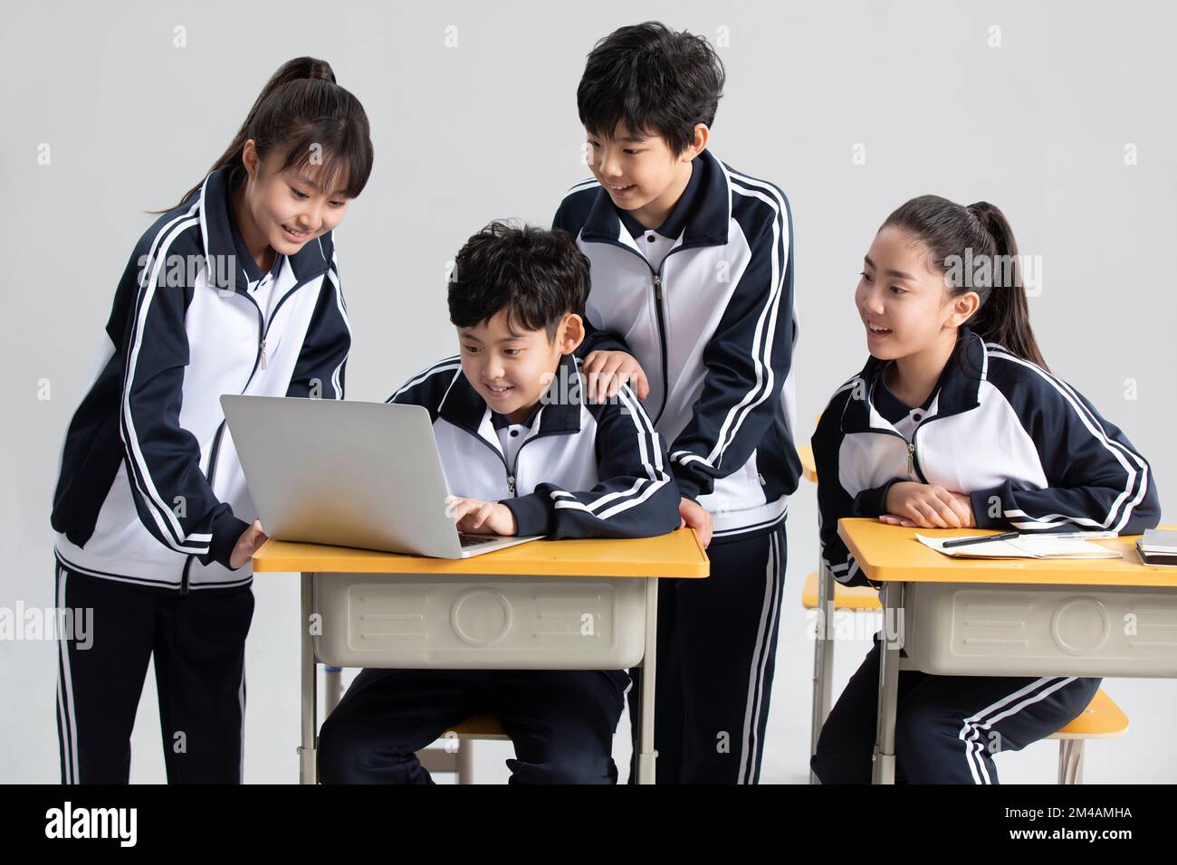 Chinese students learning with laptop in classroom Stock Photo - Alamy