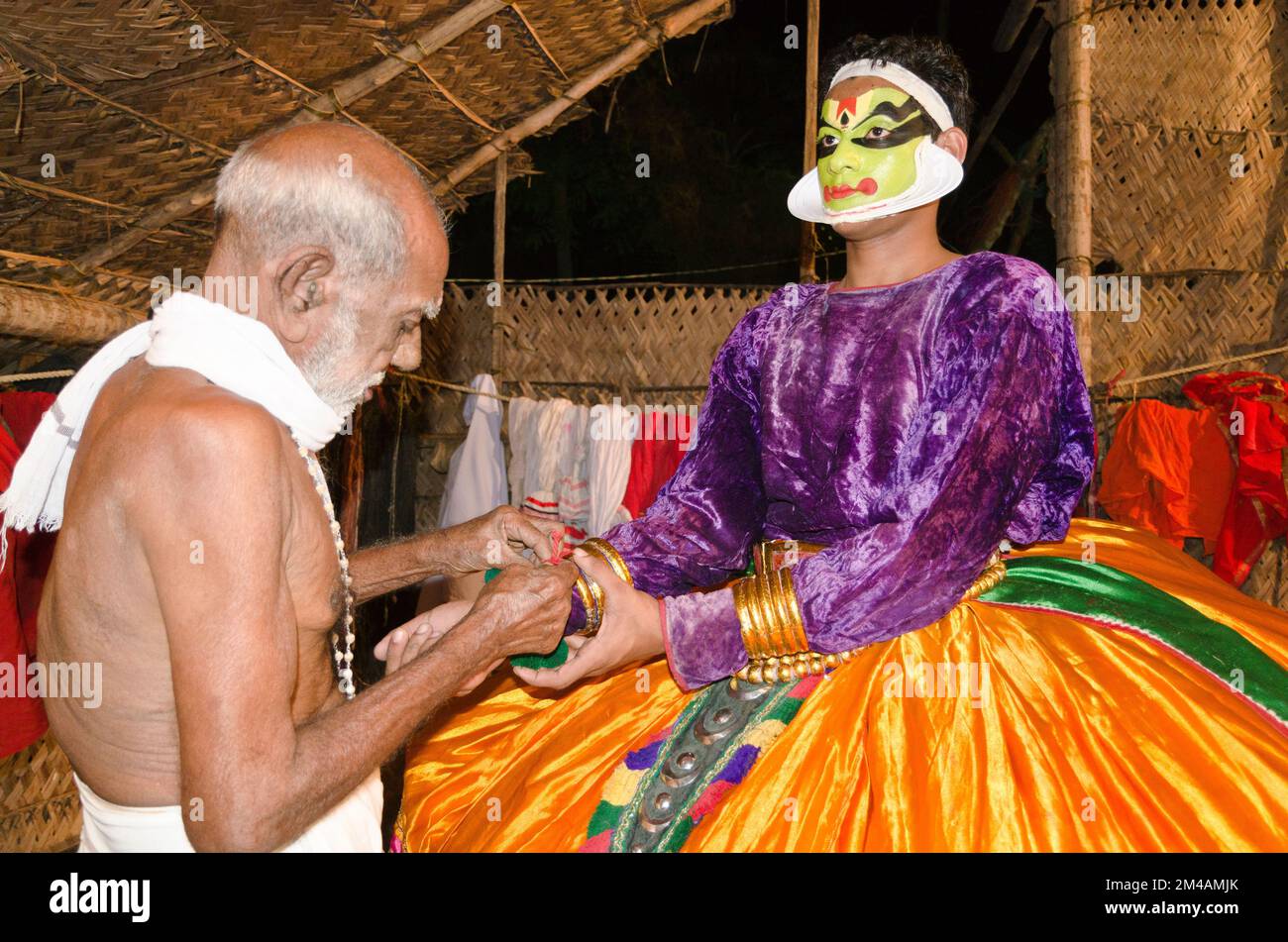 The make up of the Kathakali-character Krishna step by step Stock Photo ...