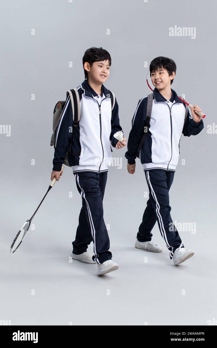 Cheerful Chinese students playing badminton Stock Photo - Alamy