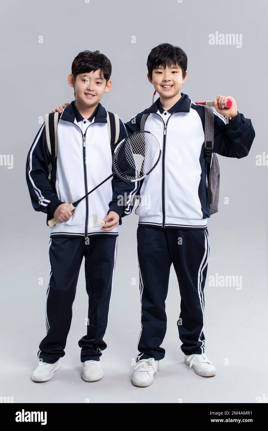 Cheerful Chinese students playing badminton Stock Photo - Alamy