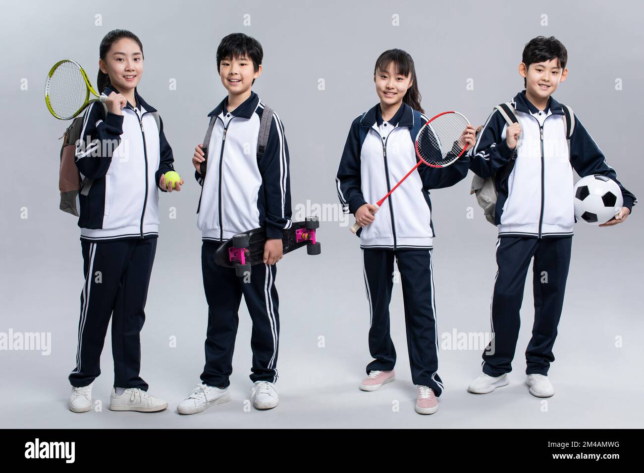Studio shot of cheerful Chinese students Stock Photo - Alamy
