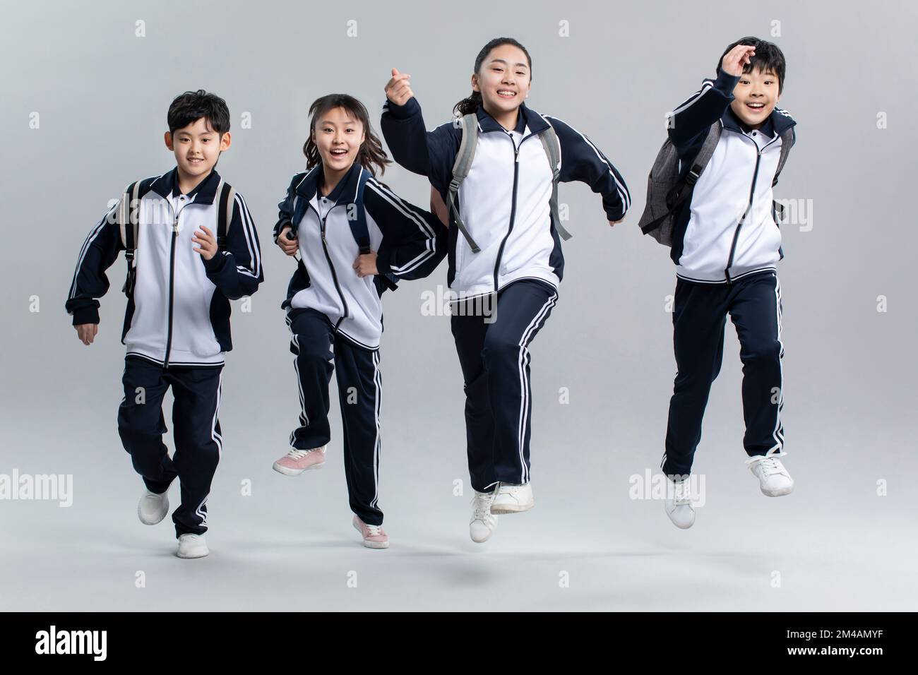 Studio shot of cheerful Chinese students Stock Photo - Alamy