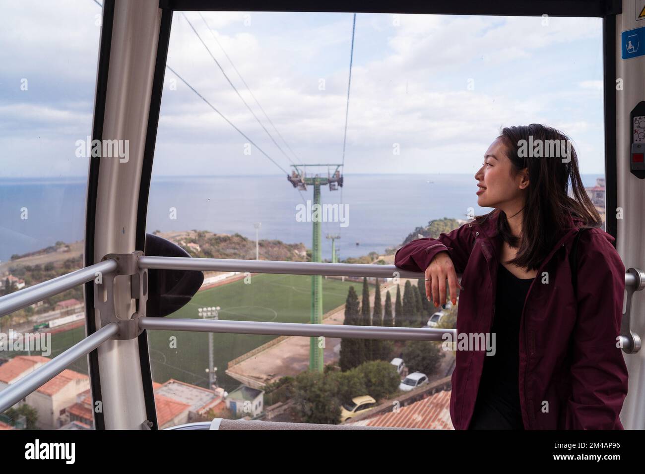 Young brunette in cable car hi-res stock photography and images - Alamy