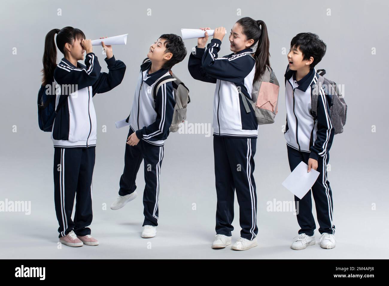 Cheerful Chinese students in uniform with their test results Stock ...