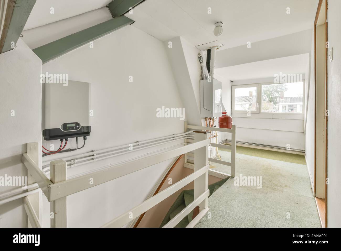 Interior of a house with stairs to an down floor in a bright ...