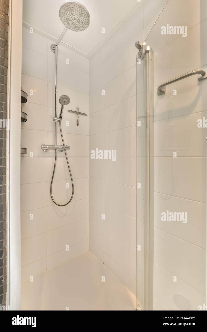 Interior of a modern shower with white walls Stock Photo - Alamy