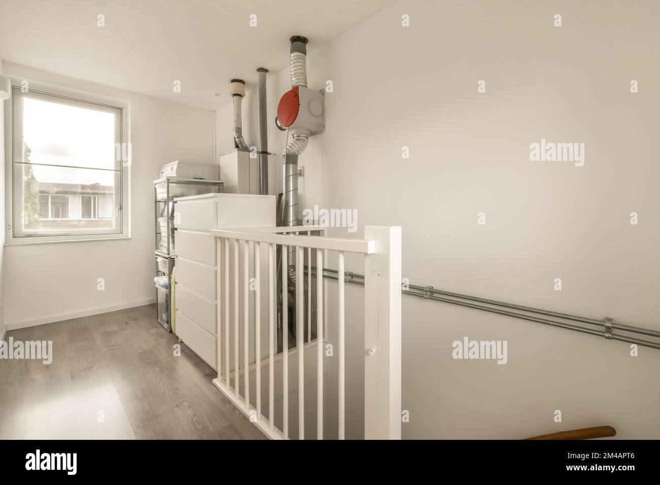 Interior of a house with stairs to an down floor in a bright ...