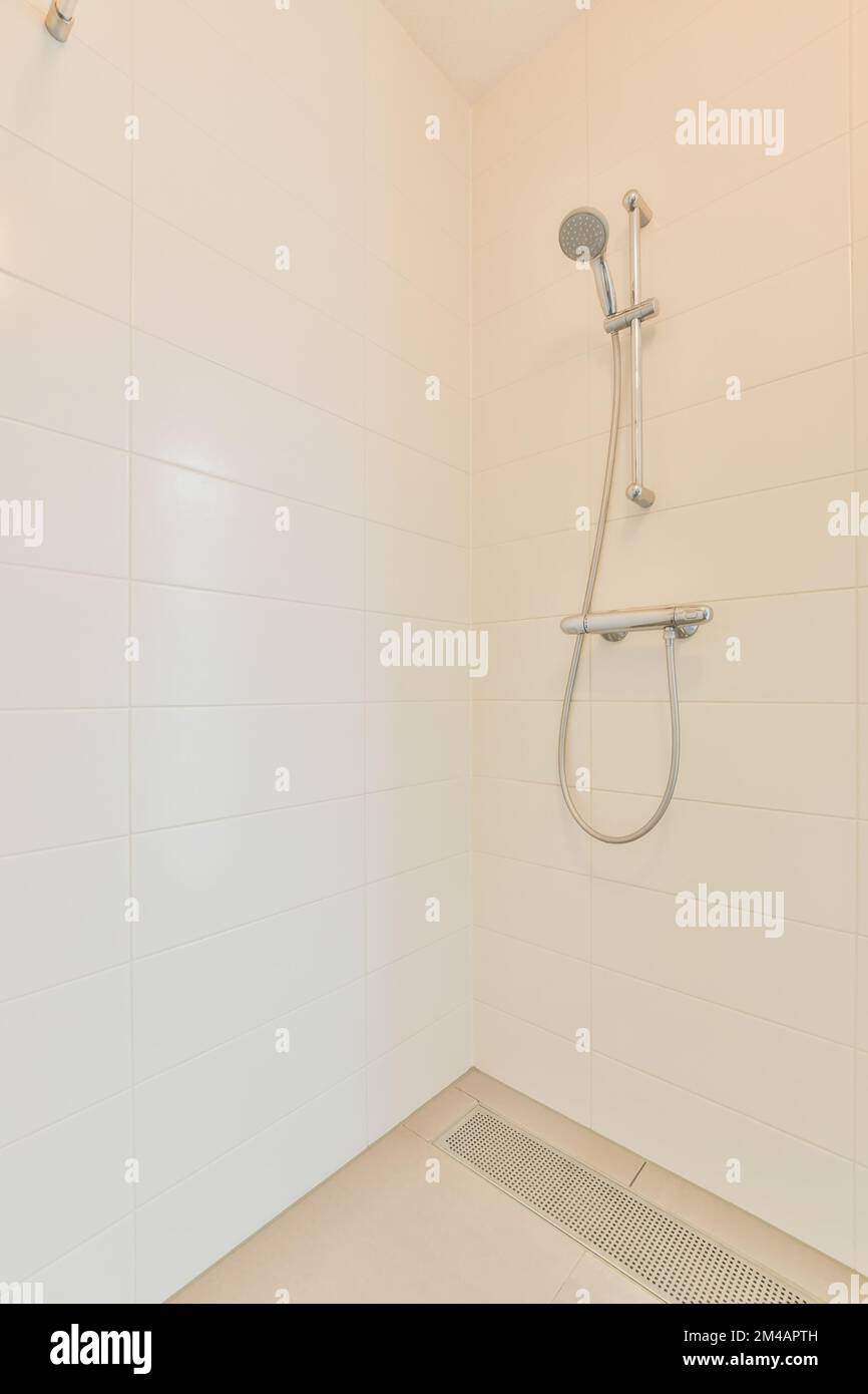 Interior of a modern shower with white walls Stock Photo - Alamy