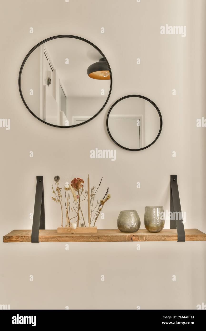 Interior passage way with mirror on wall in modern house Stock Photo ...