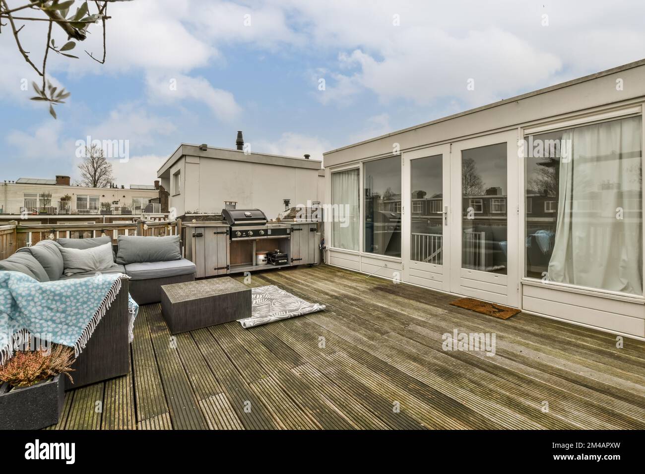 Comfortable rattan wicker sofa and armchair placed on veranda of ...