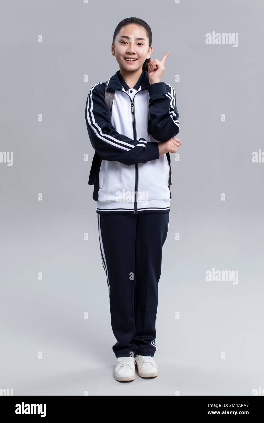 Cheerful student girl pointing camera hi-res stock photography and ...