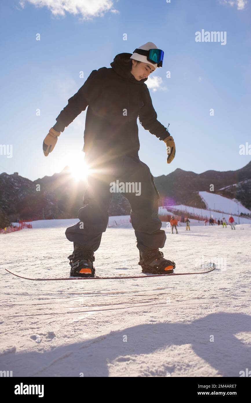 Young chinese man snowboarding hi-res stock photography and images - Alamy