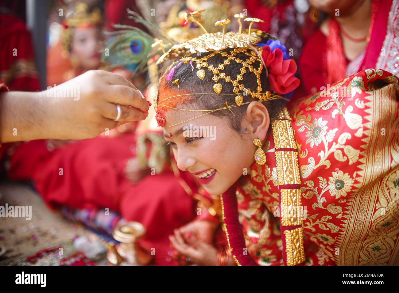 Nepal. 20th Dec, 2022. Little girl performs traditional ritual along ...