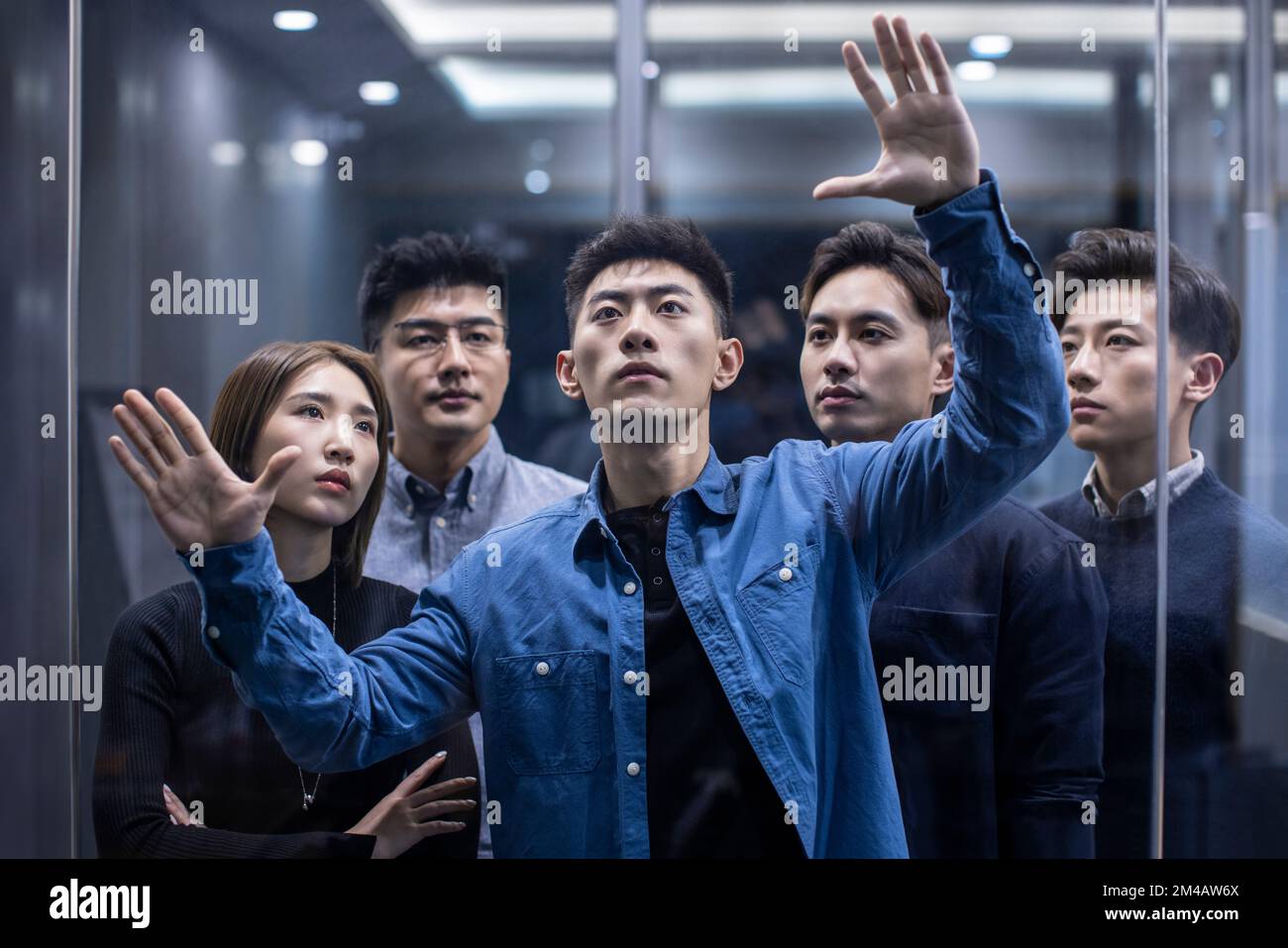 Confident Chinese designers working together Stock Photo - Alamy