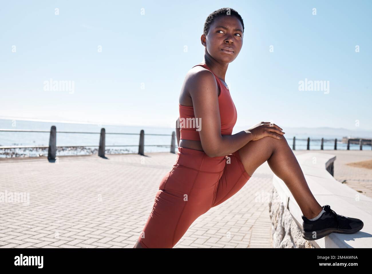 Stretching, legs and black woman on the promenade for fitness start ...
