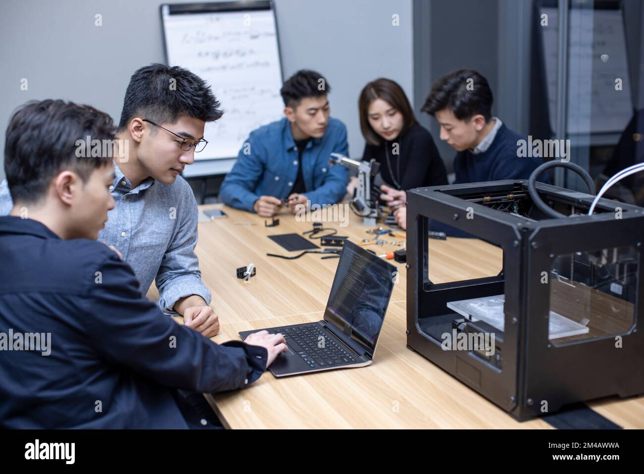 Confident Chinese designers using a 3D printer Stock Photo - Alamy
