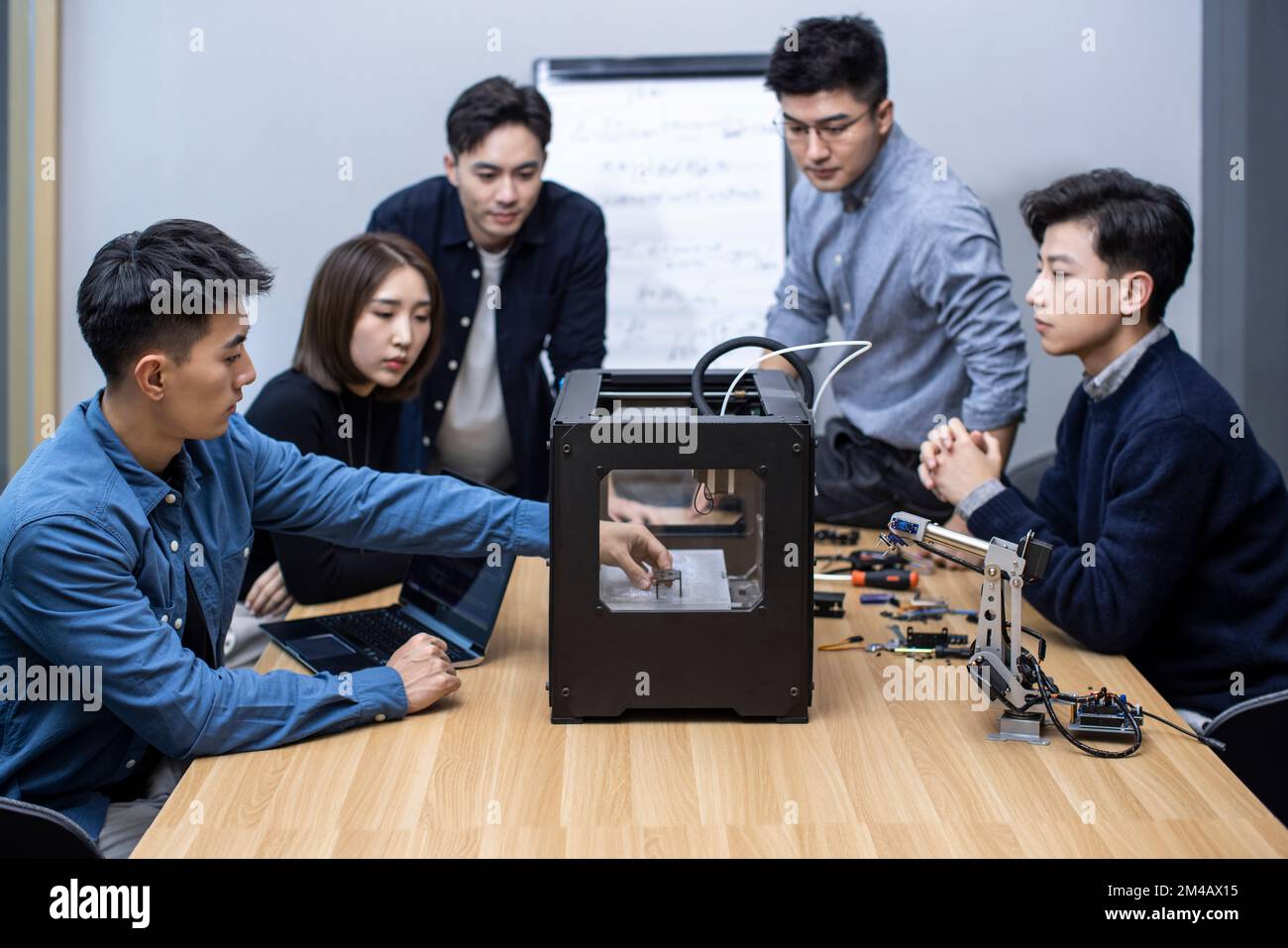 Confident Chinese designers using a 3D printer Stock Photo - Alamy