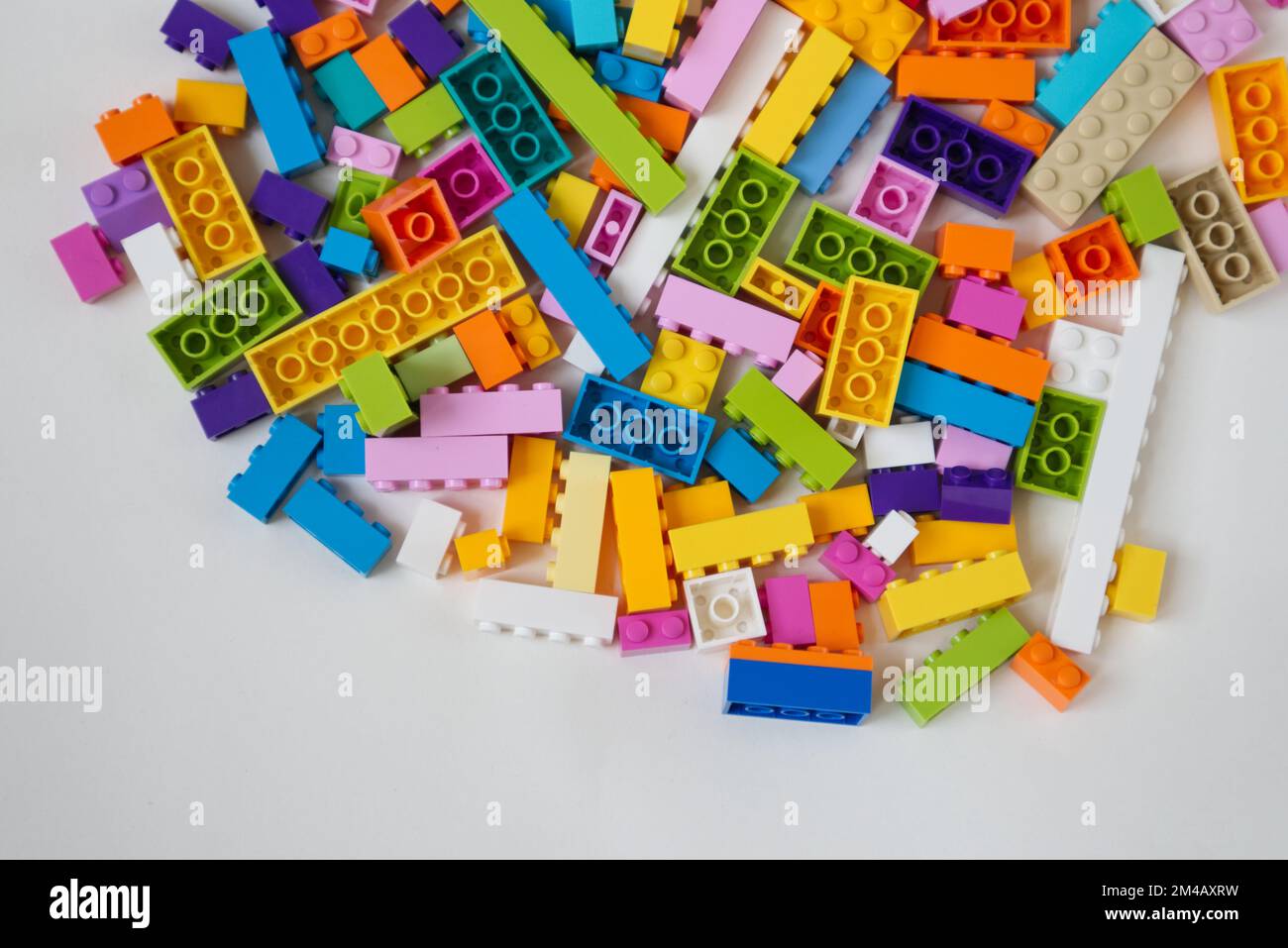 Multi-colored building blocks for children on a white background top ...