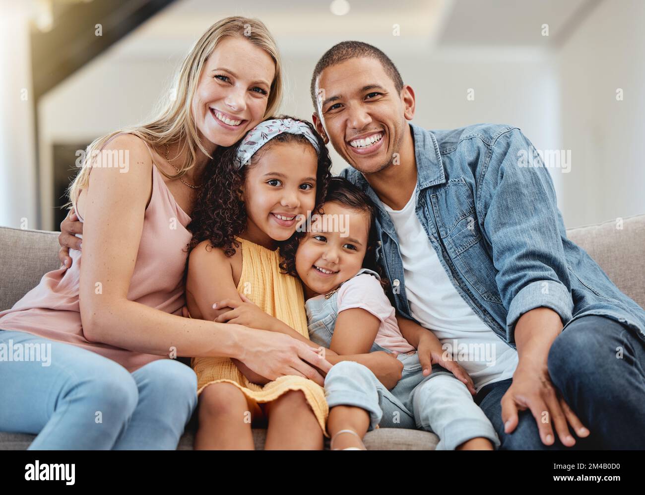 Love, diversity and portrait of happy family hug in rent house living ...