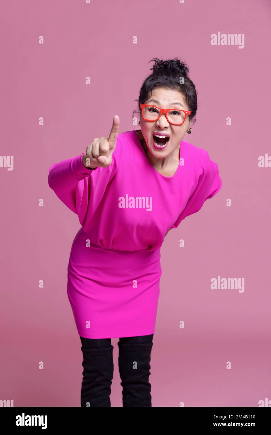 Senior Chinese woman losing temper Stock Photo - Alamy