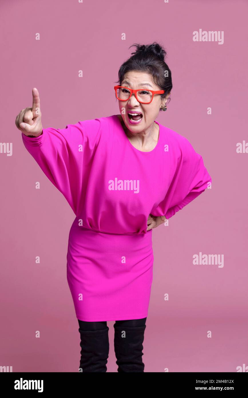 Senior Chinese woman losing temper Stock Photo - Alamy