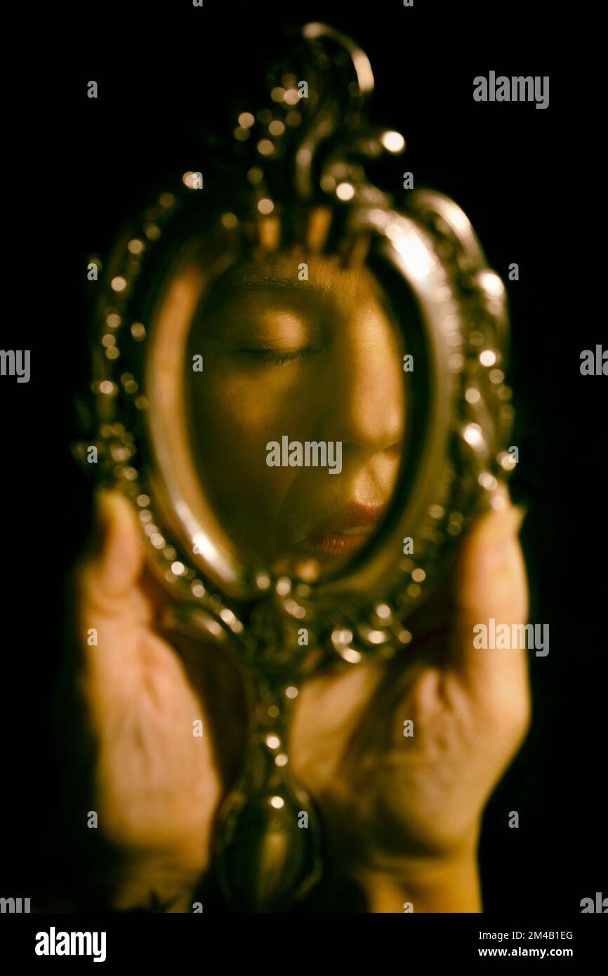 woman reflected in old silver mirror III Stock Photo - Alamy