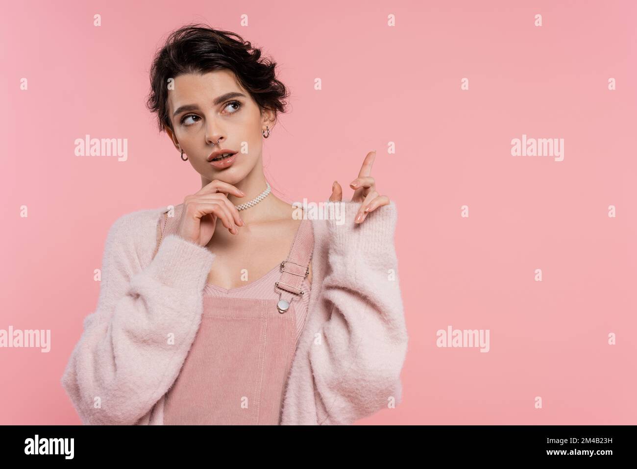 Point finger on chin hi-res stock photography and images - Alamy