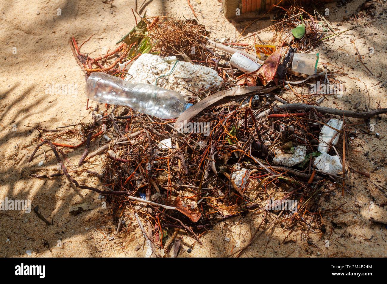 Garbage sea sand beach, unsorted rubbish, plastic bag, glass bottle ...