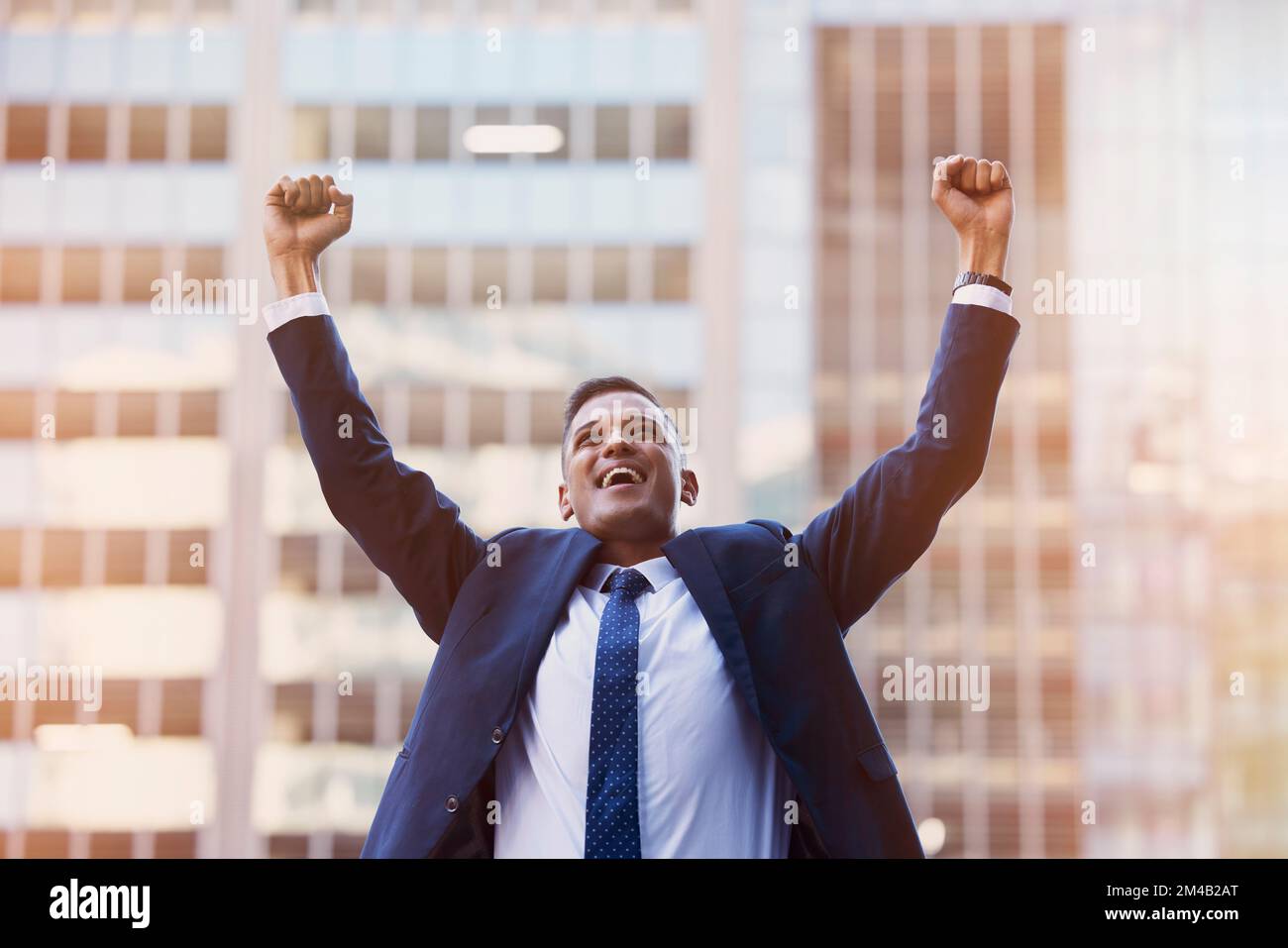 Businessman, success and winner with happy corporate employee ...