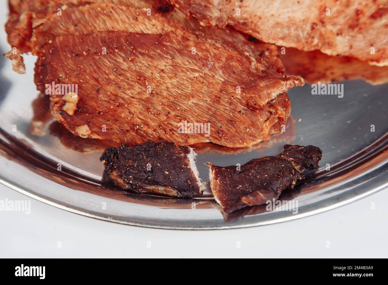 Cured meat full frame meat close-up. small, thin pieces cut into ...