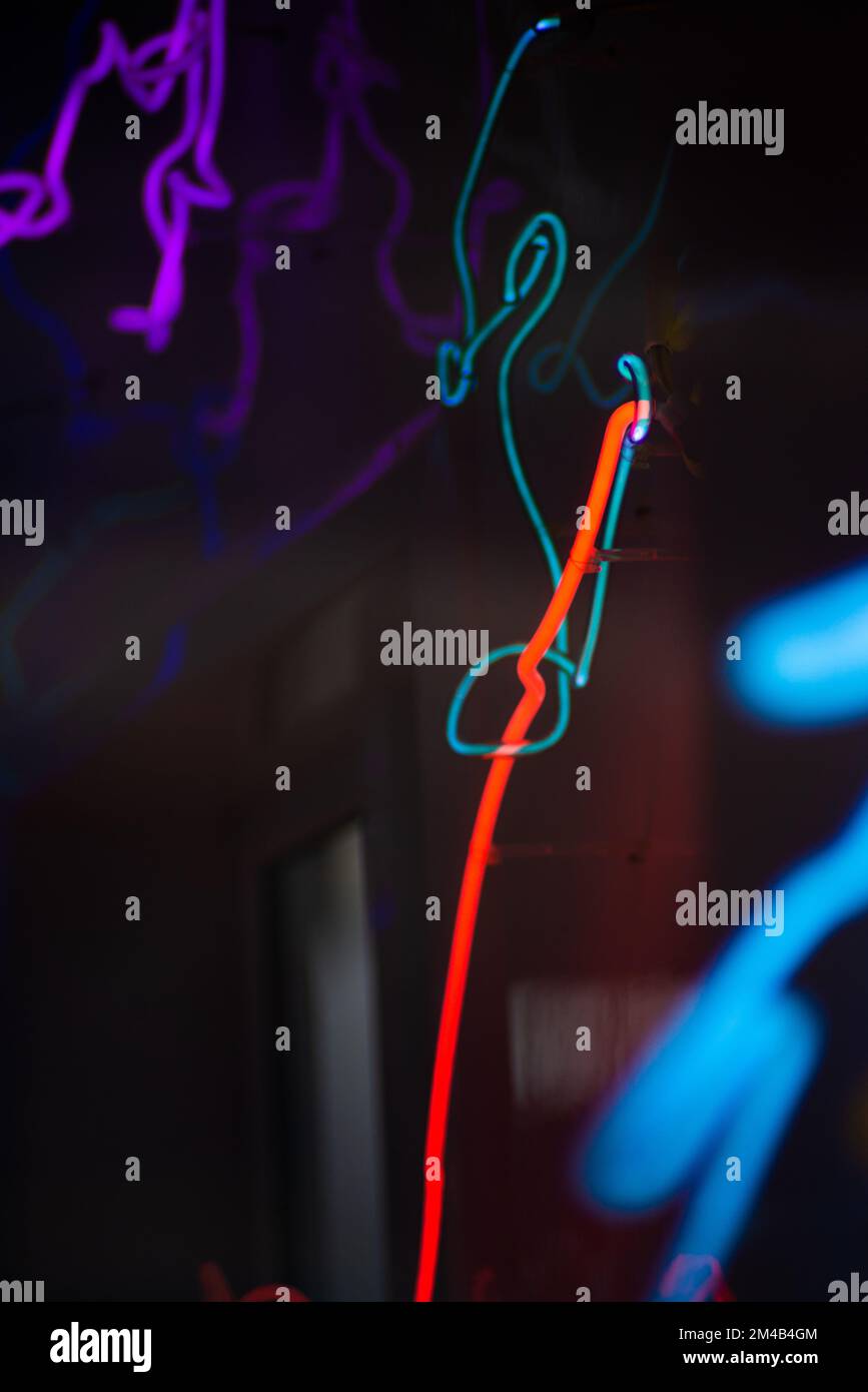 A close-up shot of a red and blue neon sign Stock Photo - Alamy