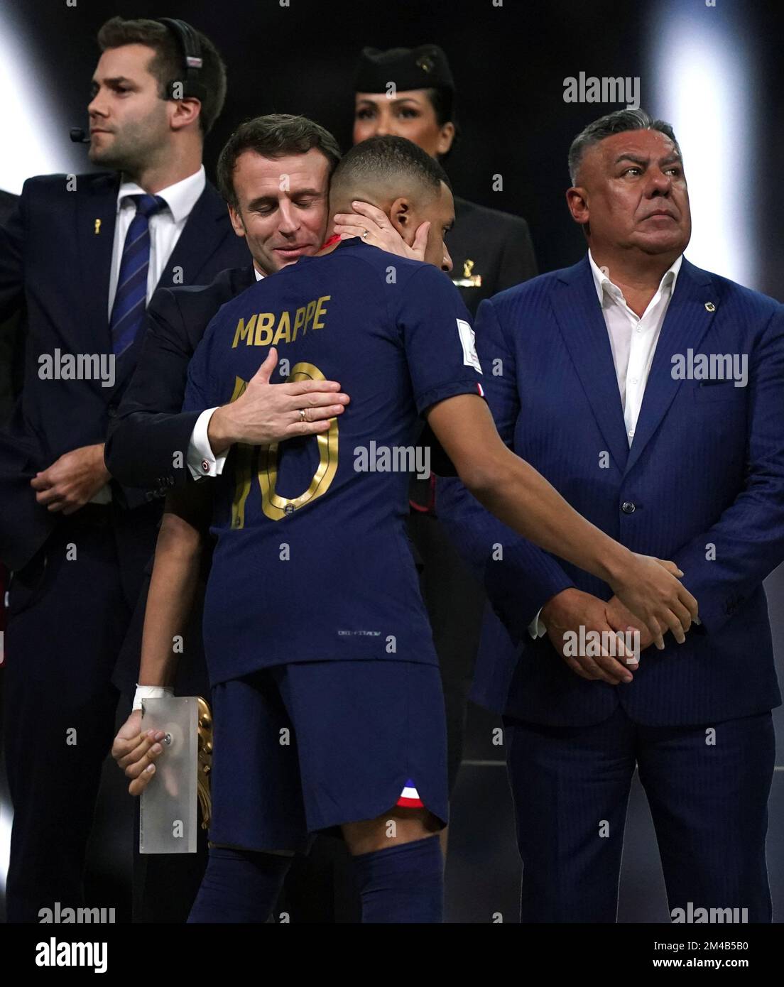 President of France, Emmanuel Macron consoles France's Kylian Mbappe ...