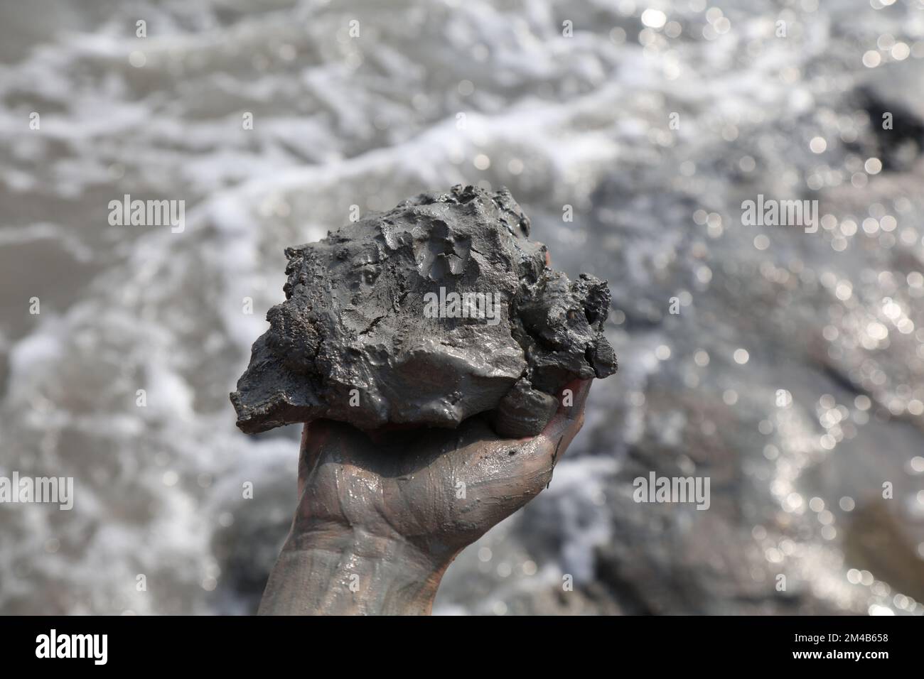 Dead Sea mud in Israel. Dead Sea mud handful. It has medicinal ...