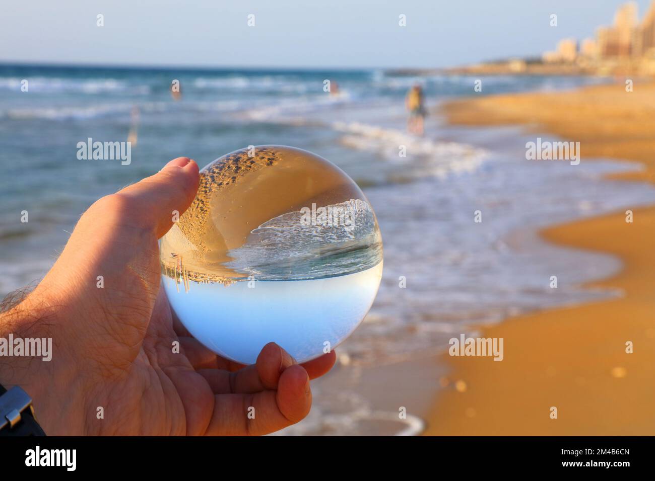 Beach vibes in Haifa, Israel. Glass ball reflection of Dado Beach in ...