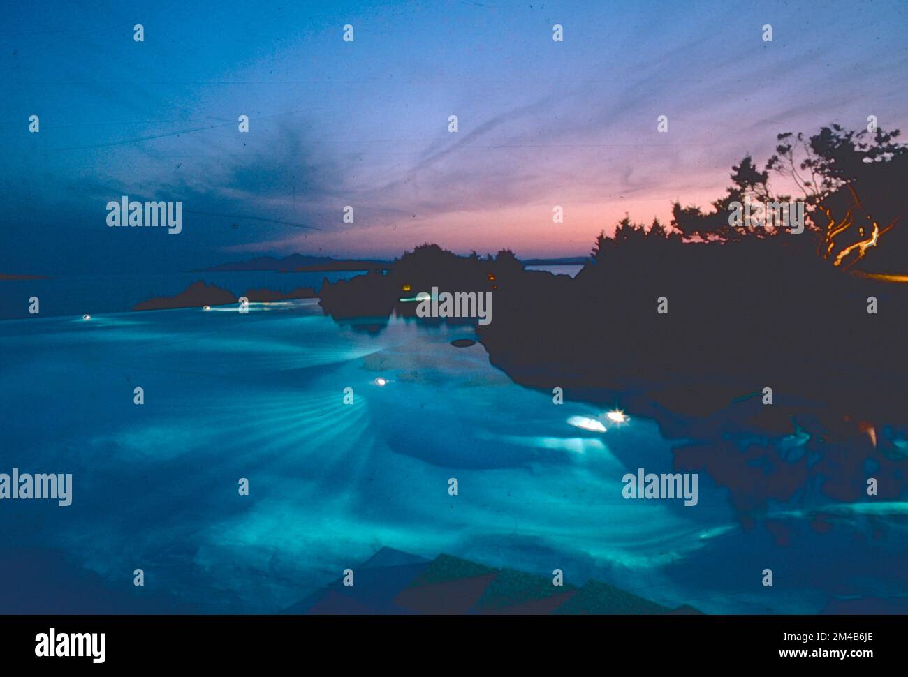 Sunset at sea with underwater lights, Italy 1990s Stock Photo - Alamy