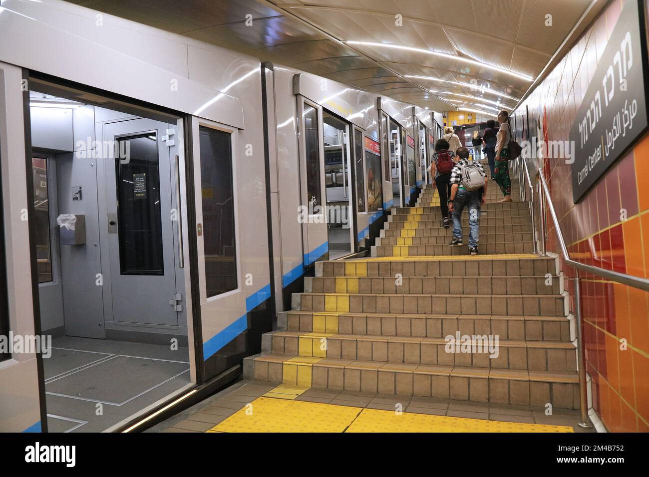 HAIFA, ISRAEL - OCTOBER 31, 2022: Passengers alight Carmelit ...