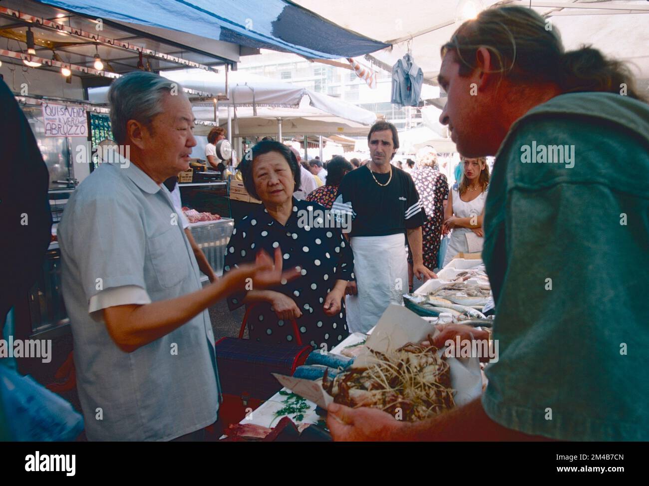 Chinese people shopping at the Piazza Vittorio Emanuele market at ...