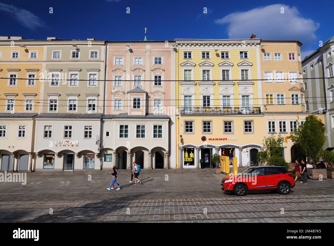 LINZ, AUSTRIA - AUGUST 1, 2022: People visit the main square Hauptplatz ...