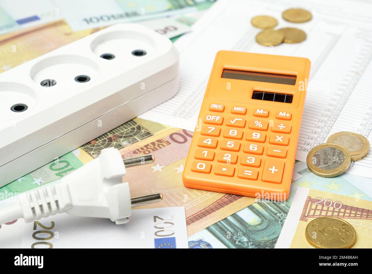 Power plug and Calculator on Euro Banknotes Background. Increasing ...