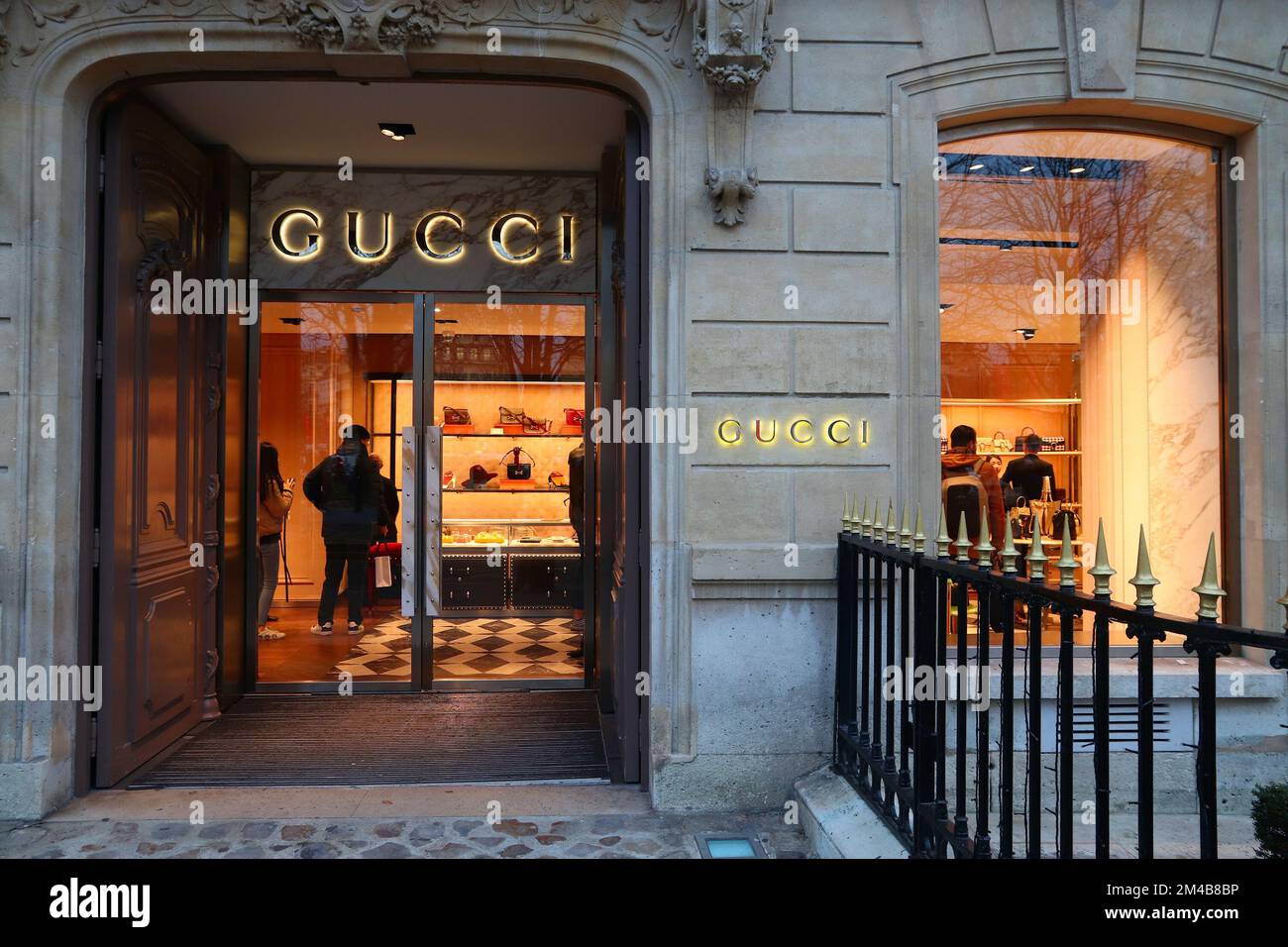 PARIS, FRANCE - DECEMBER 10, 2019: People shop at Gucci fashion store ...