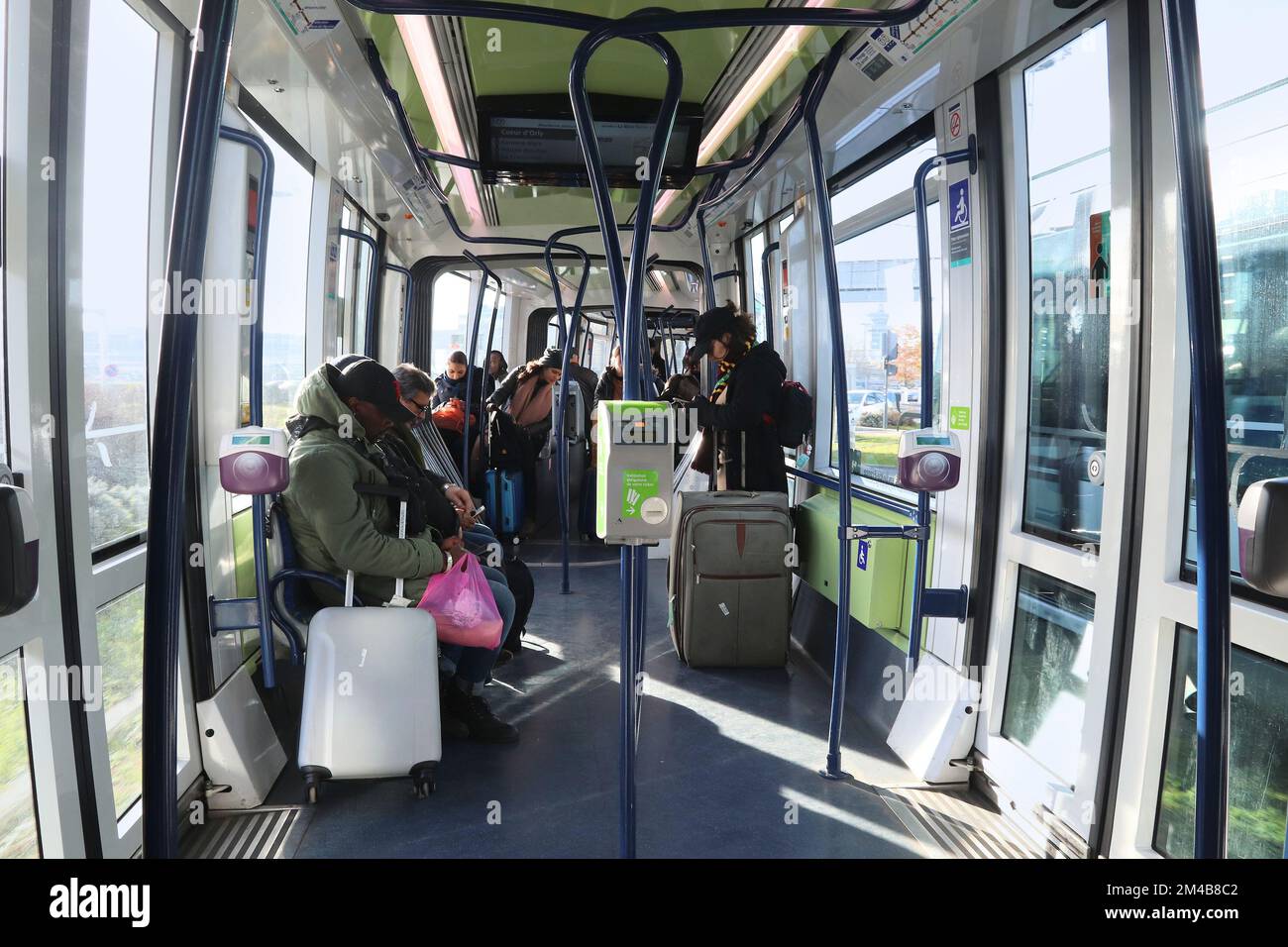 PARIS, FRANCE - DECEMBER 10, 2019: Passengers ride a public ...