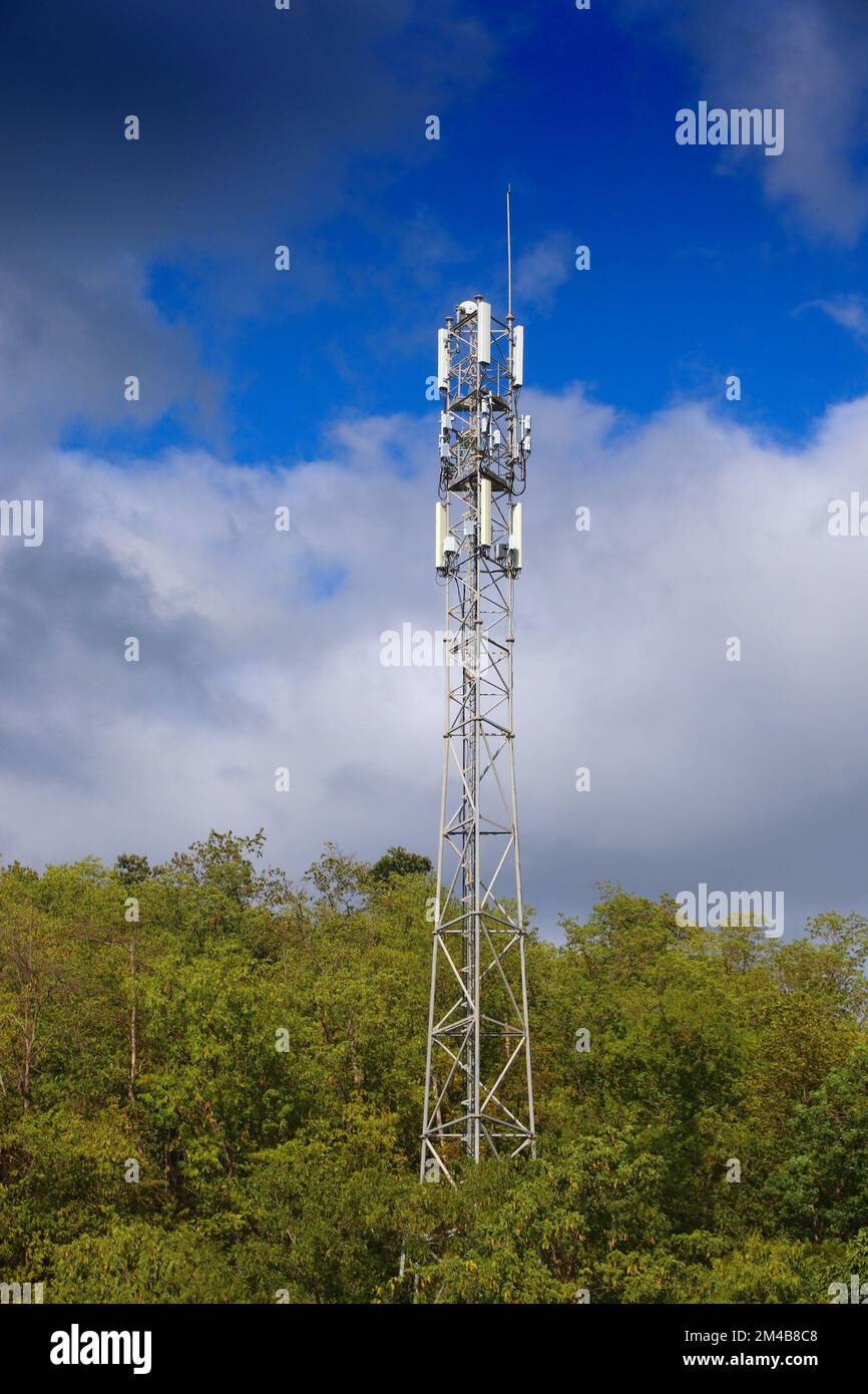 Telecom base station in Guadeloupe. Cell tower sector antennas. Mobile network operator ...