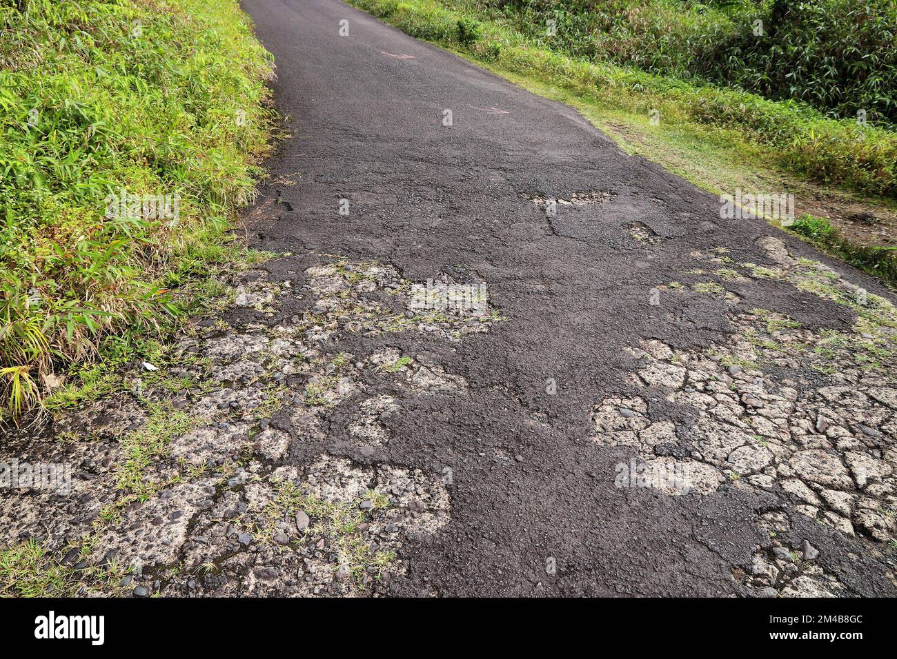 Pothole road in Guadeloupe. Countryside road maintenance concept Stock ...