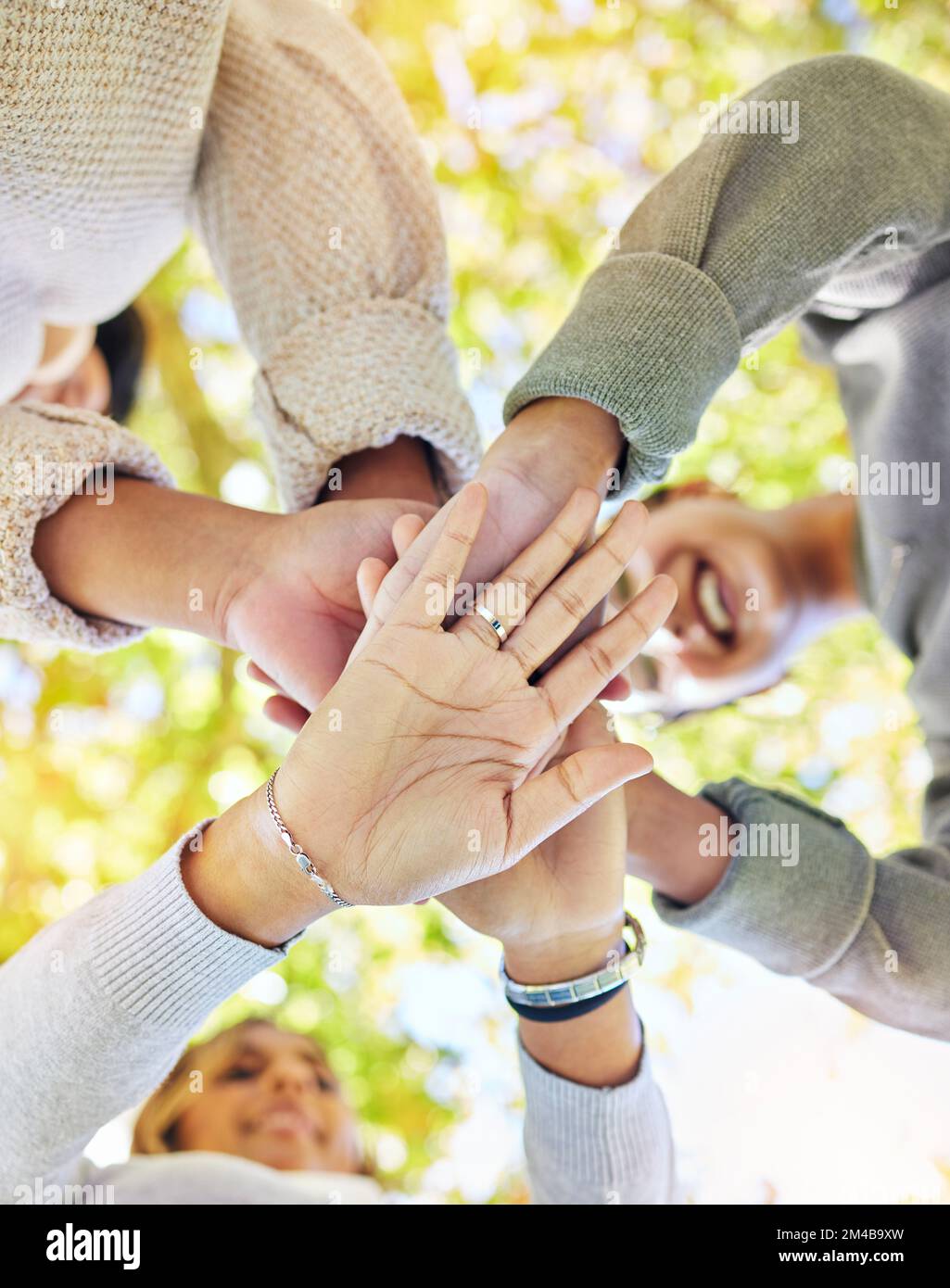 Hands stack, support with trust and team building outdoor, commitment ...