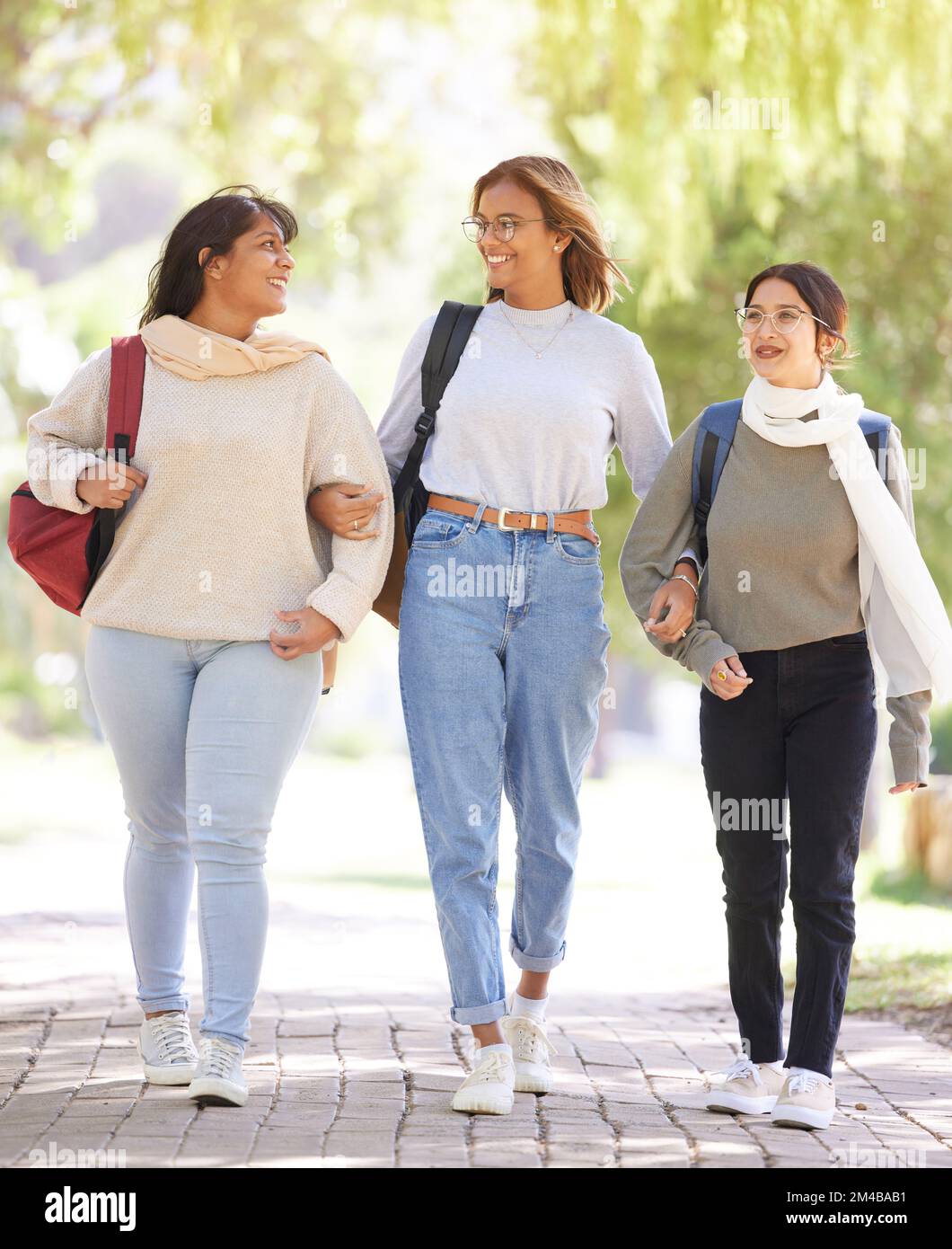 Friends, women and students outdoor, walking and conversation on break ...
