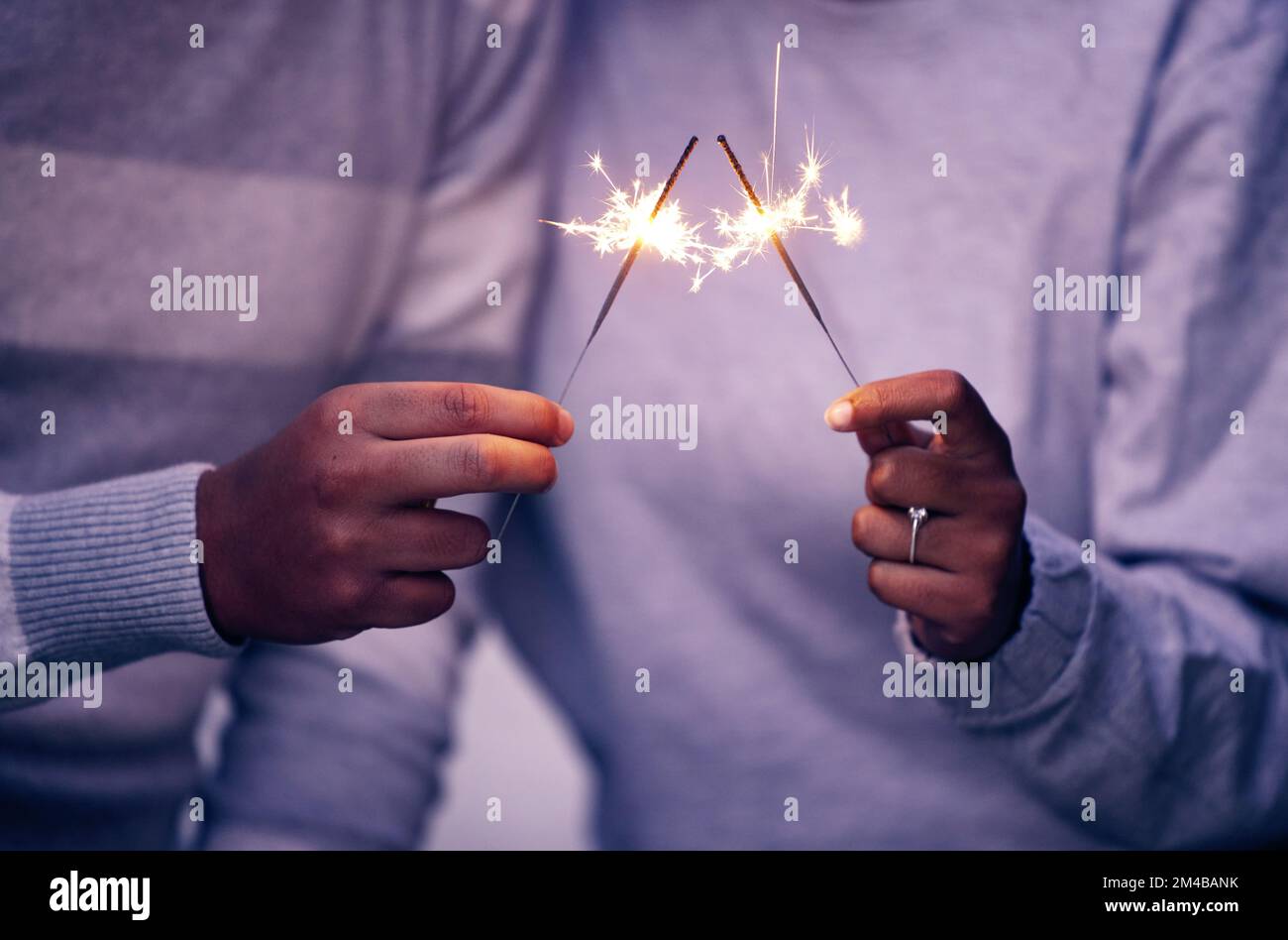 Sparklers, hands and couple celebration with lights, sparks and magic ...