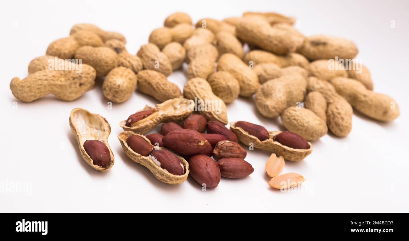 peanut kernels on a white background Stock Photo - Alamy