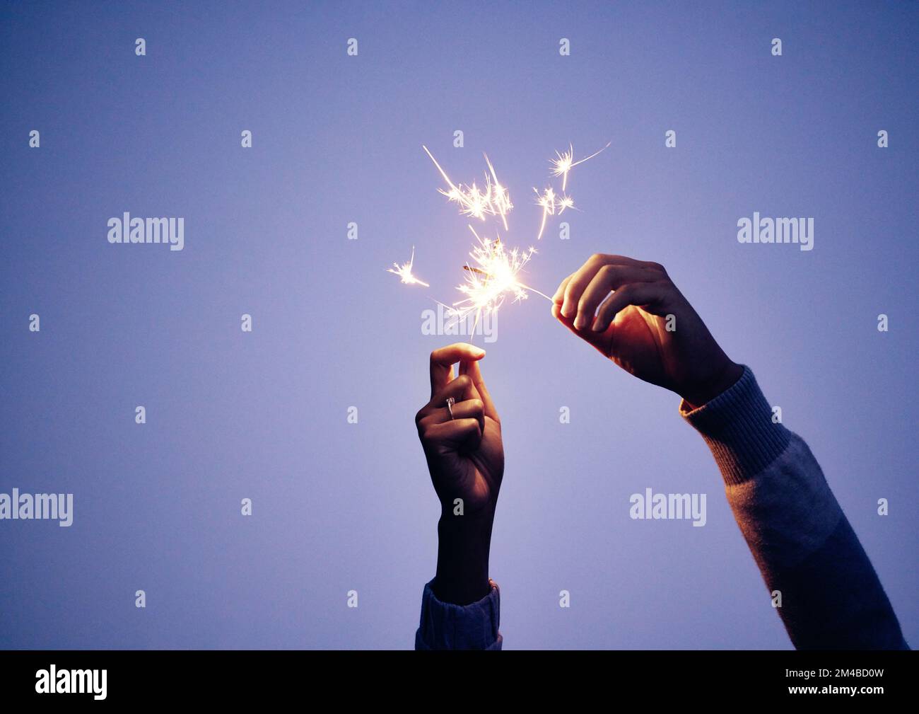 Sparkler, hand and person at night for new years eve celebration with ...