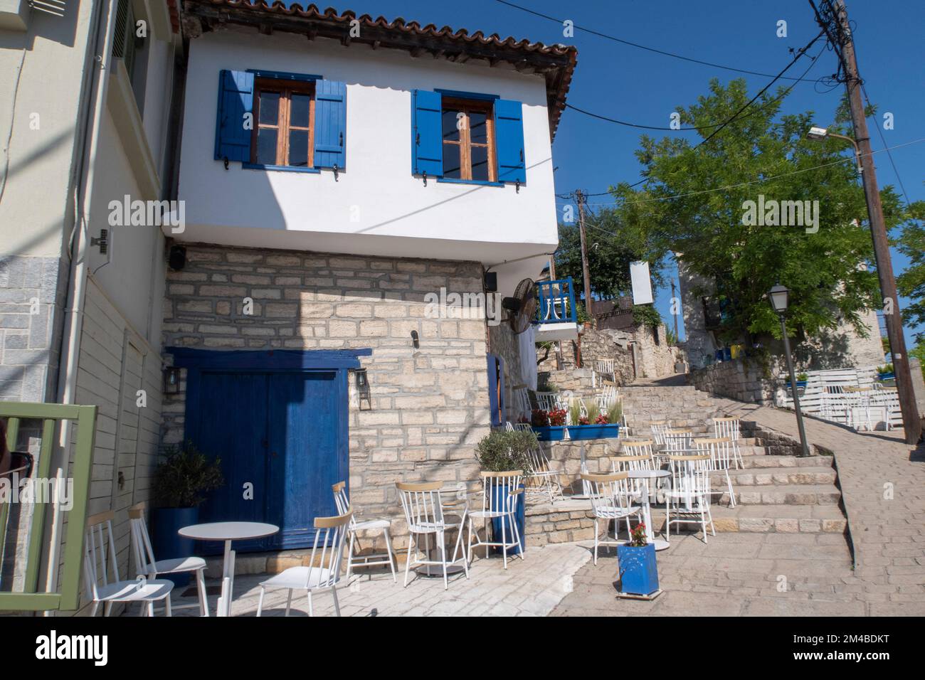 Traditional Greek restaurant with blue and white walls and window ...